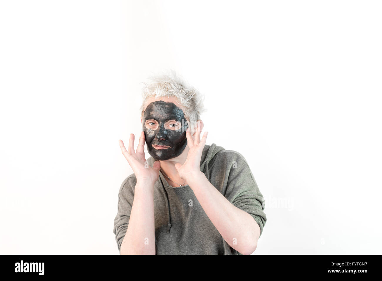 show pure emotions - face of a woman with a black mask showing ...