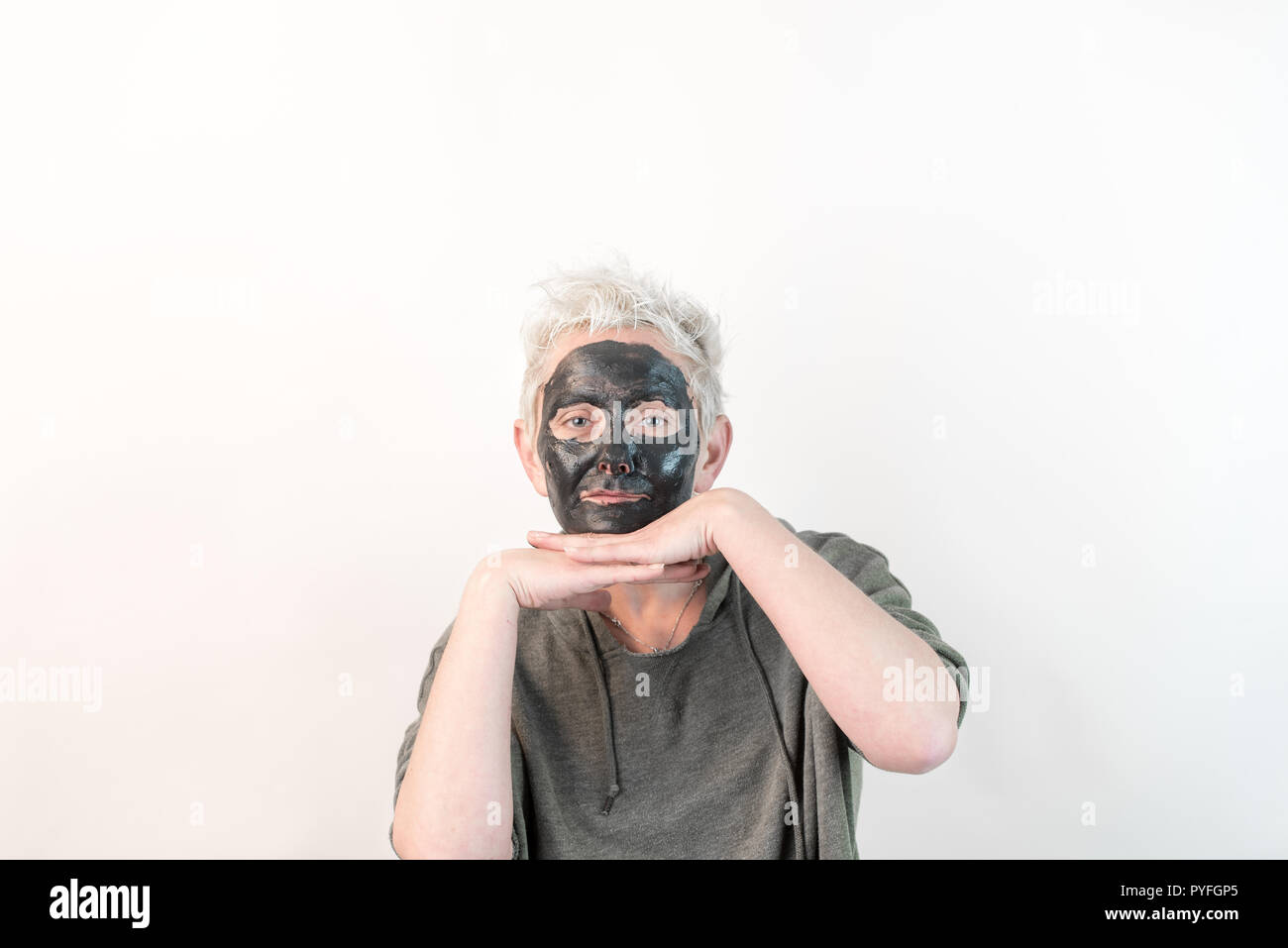 show pure emotions - face of a woman with a black mask showing ...