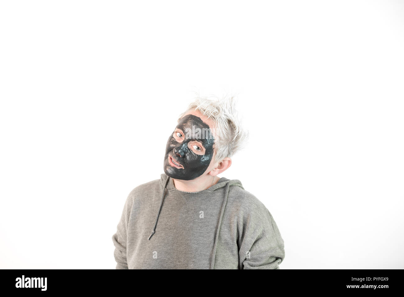 show pure emotions - face of a woman with a black mask showing ...