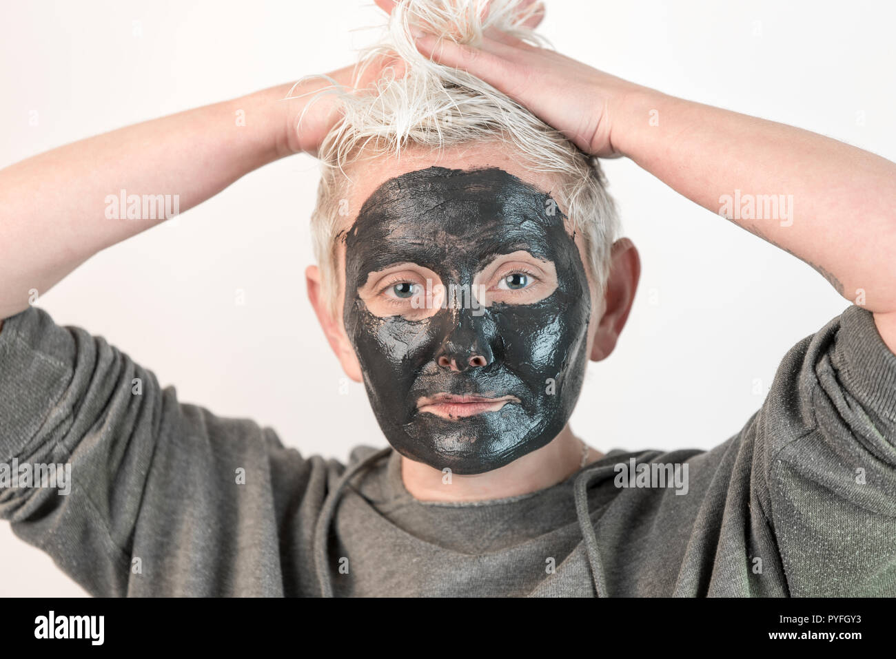 show pure emotions - face of a woman with a black mask showing ...