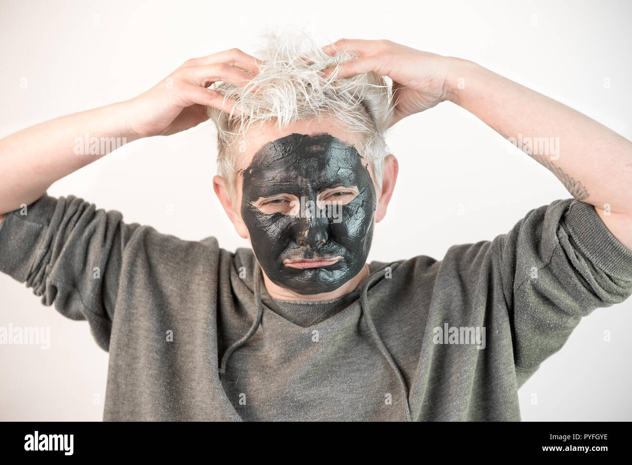 show pure emotions - face of a woman with a black mask showing ...
