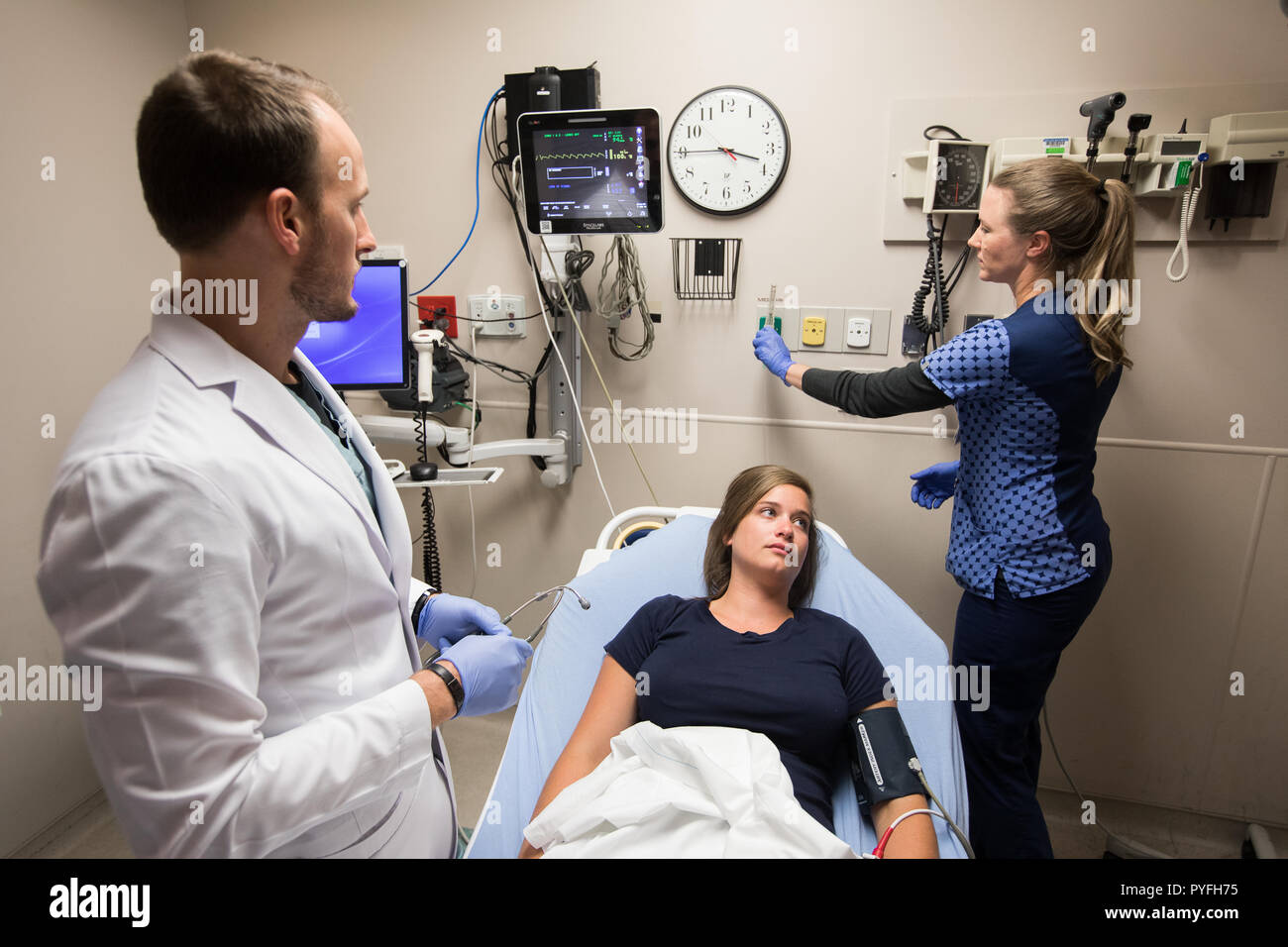 Emergency Room doctor and nurse with patient at hospital Stock Photo ...