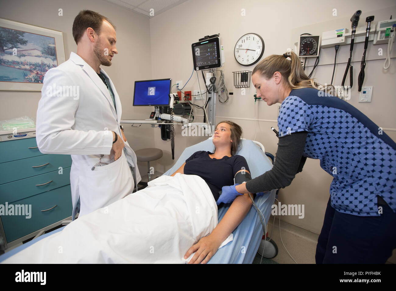 Emergency Room doctor and nurse with patient at hospital Stock Photo ...