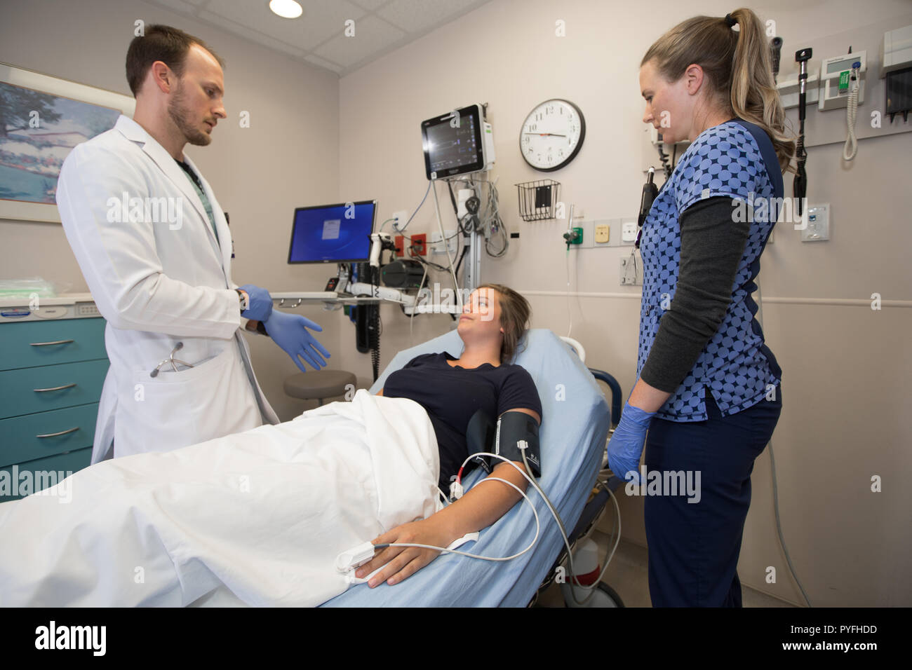 Emergency Room doctor and nurse with patient at hospital Stock Photo ...