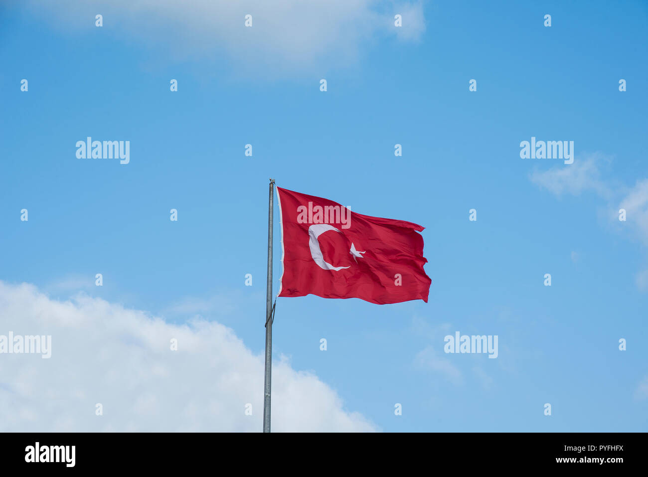 Turkish red Flag on the pole with the blue sky Stock Photo - Alamy