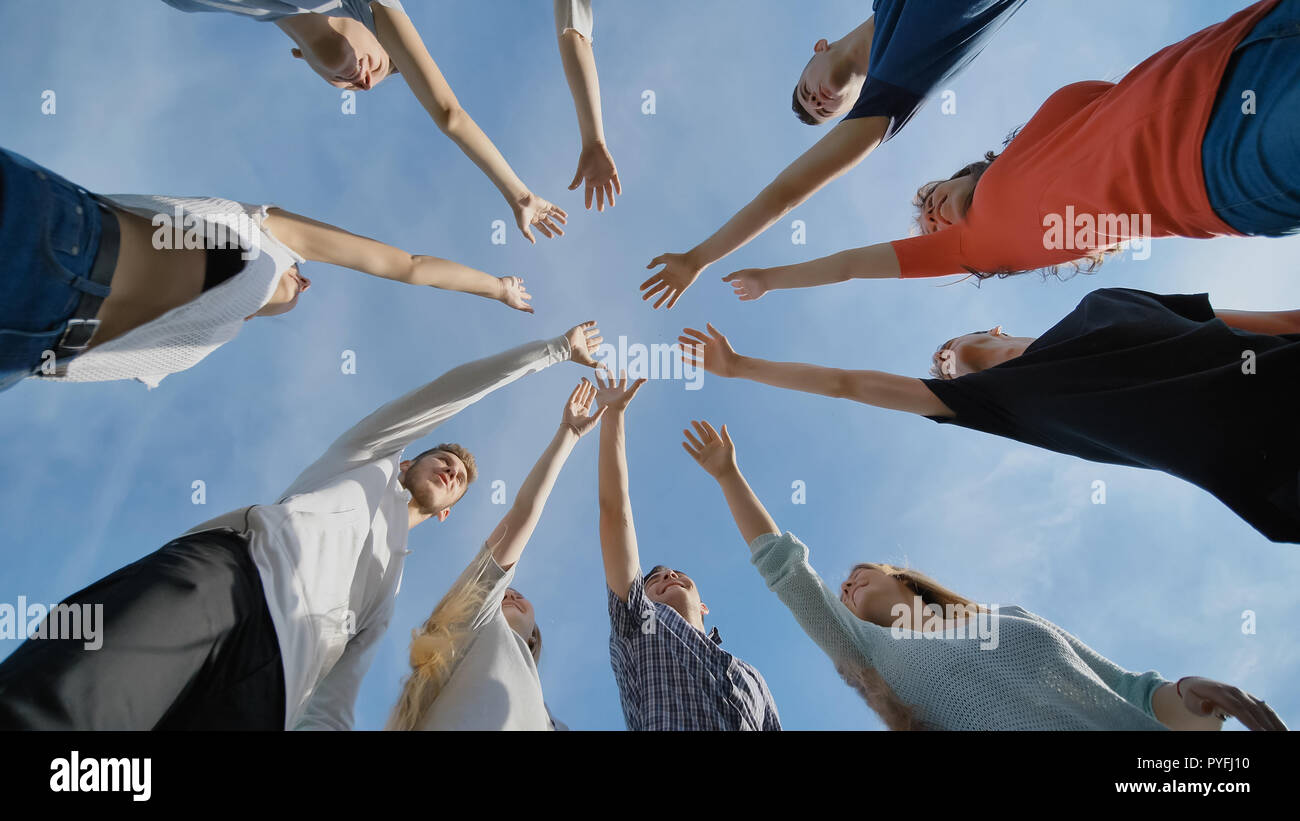 College students teamwork stacking hand hi-res stock photography and ...