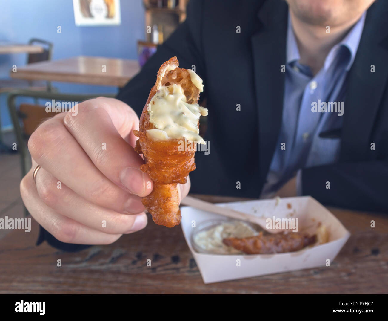 Battered fish hand hi-res stock photography and images - Alamy