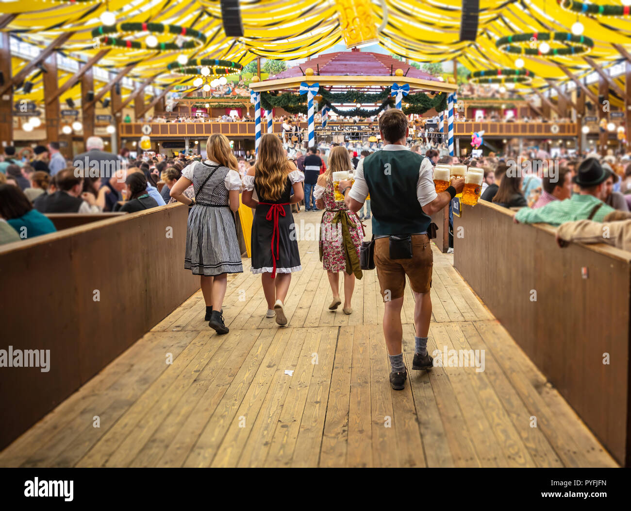 Oktoberfest, Munich, Germany. Waiter with traditional costume holding ...