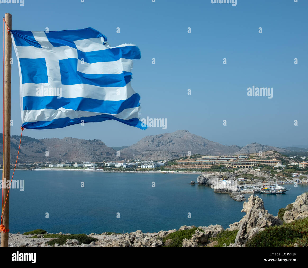 Greek flag flowing over sort in Rhodes, Greece Stock Photo - Alamy