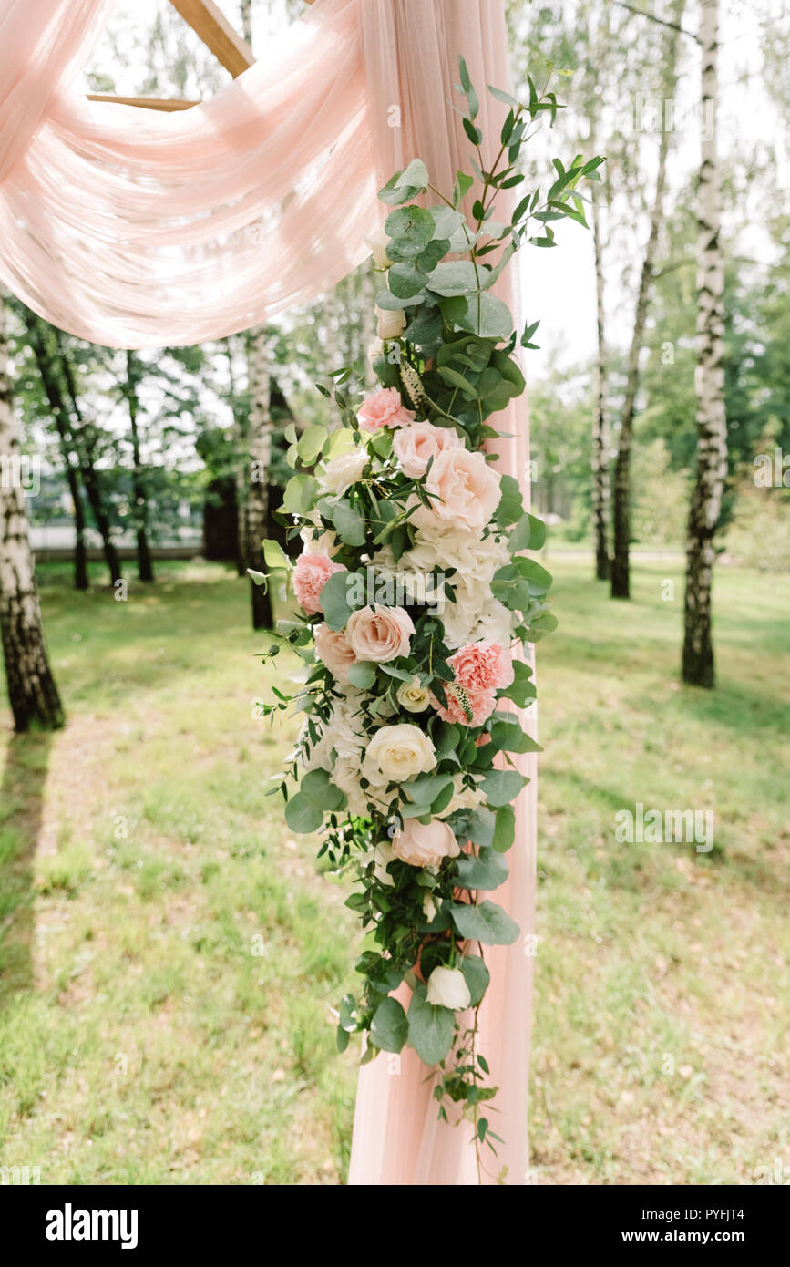 Beautiful flowers and roses of pastel color on a wedding arch Stock ...