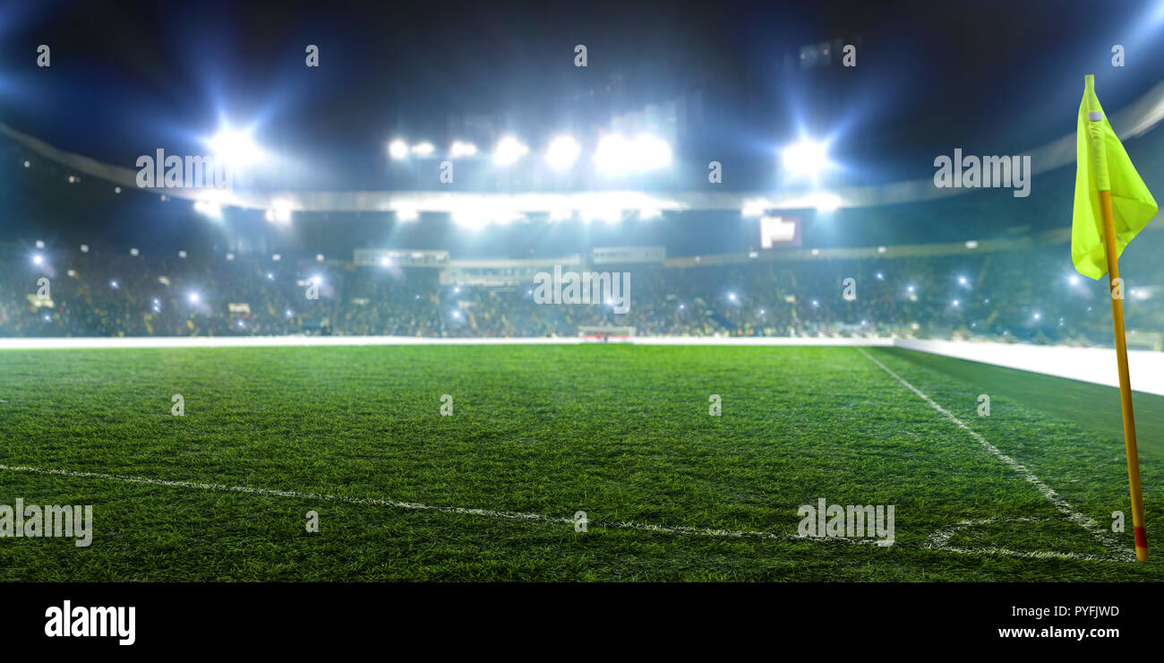 Football stadium, corner flag, shiny lights, view from field grass ...