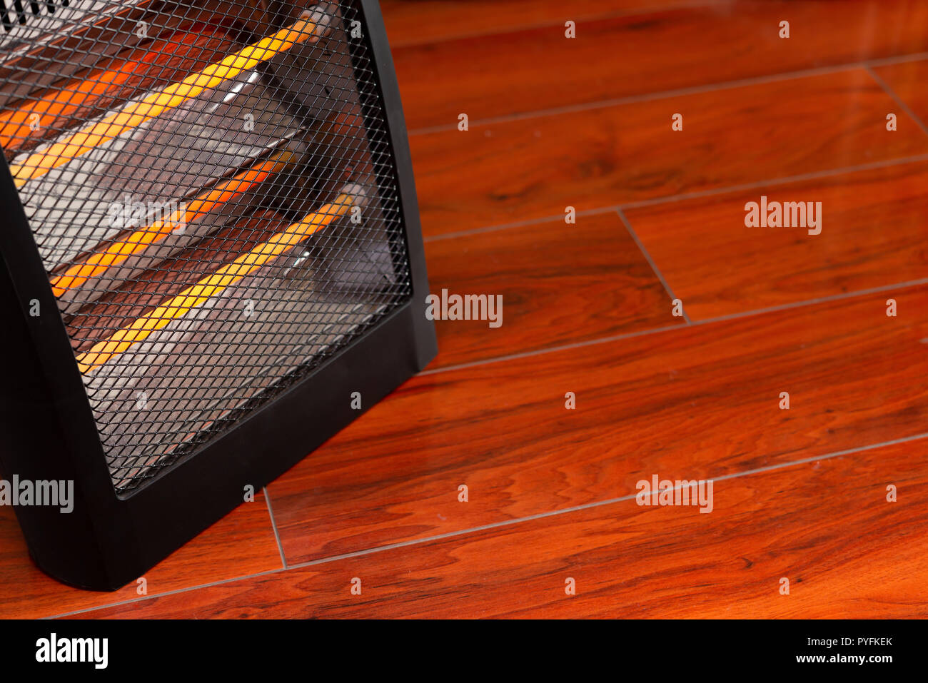 electric heater working in a room with copy space Stock Photo - Alamy