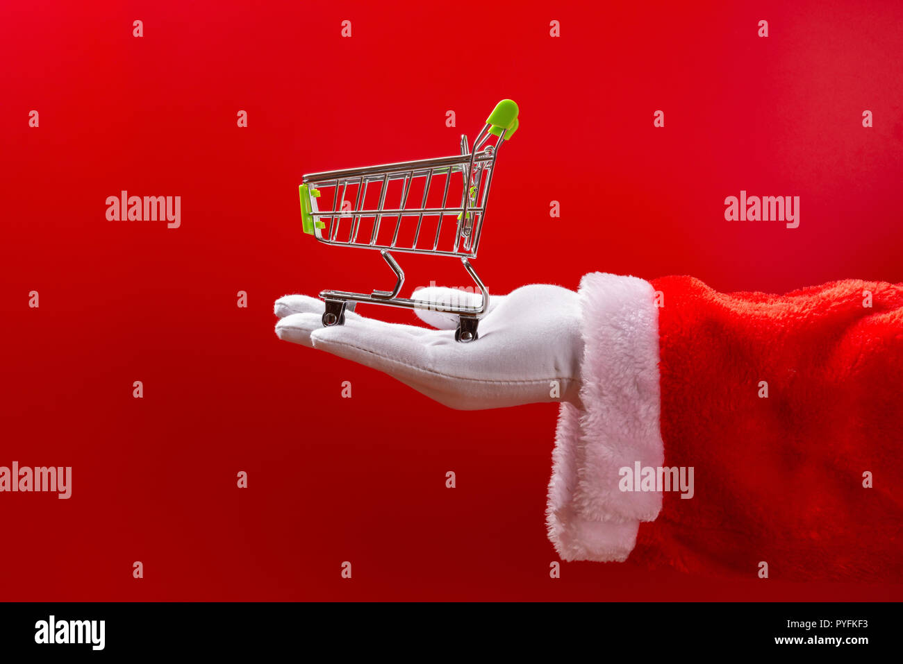 santa claus holding an empty shopping cart on hand Stock Photo - Alamy