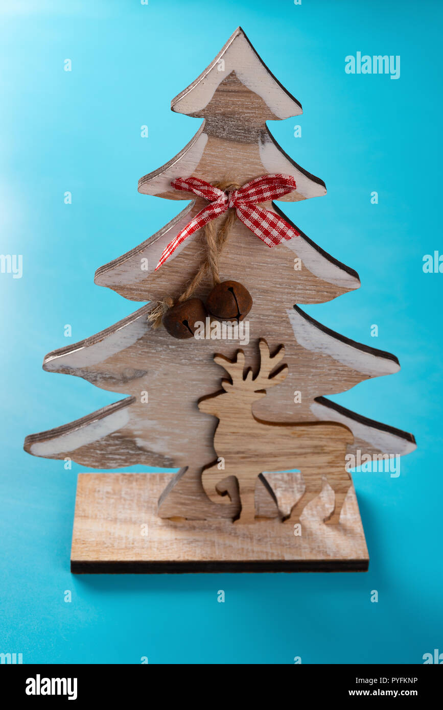 wooden dummy green Christmas tree with reindeer on blue Stock Photo - Alamy