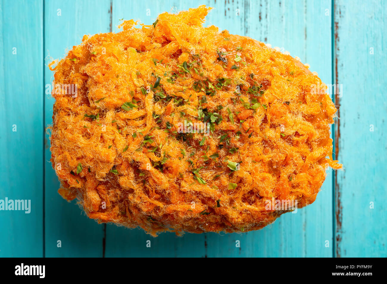 top view shredded pork bread on blue wood background Stock Photo - Alamy