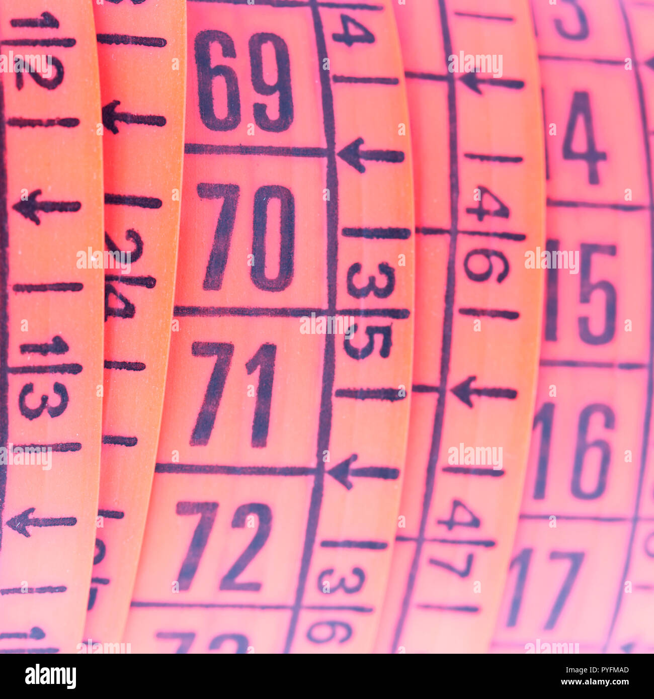 in the white light rotation of a red measure tape like concept measure ...