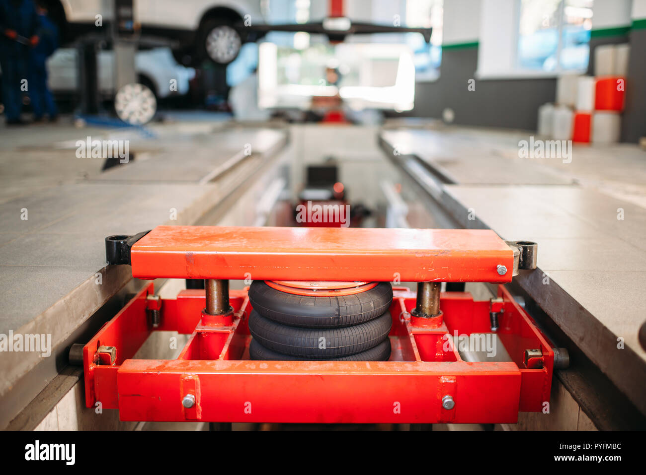 Collapse of convergence stand jack closeup, auto-service. Computer ...