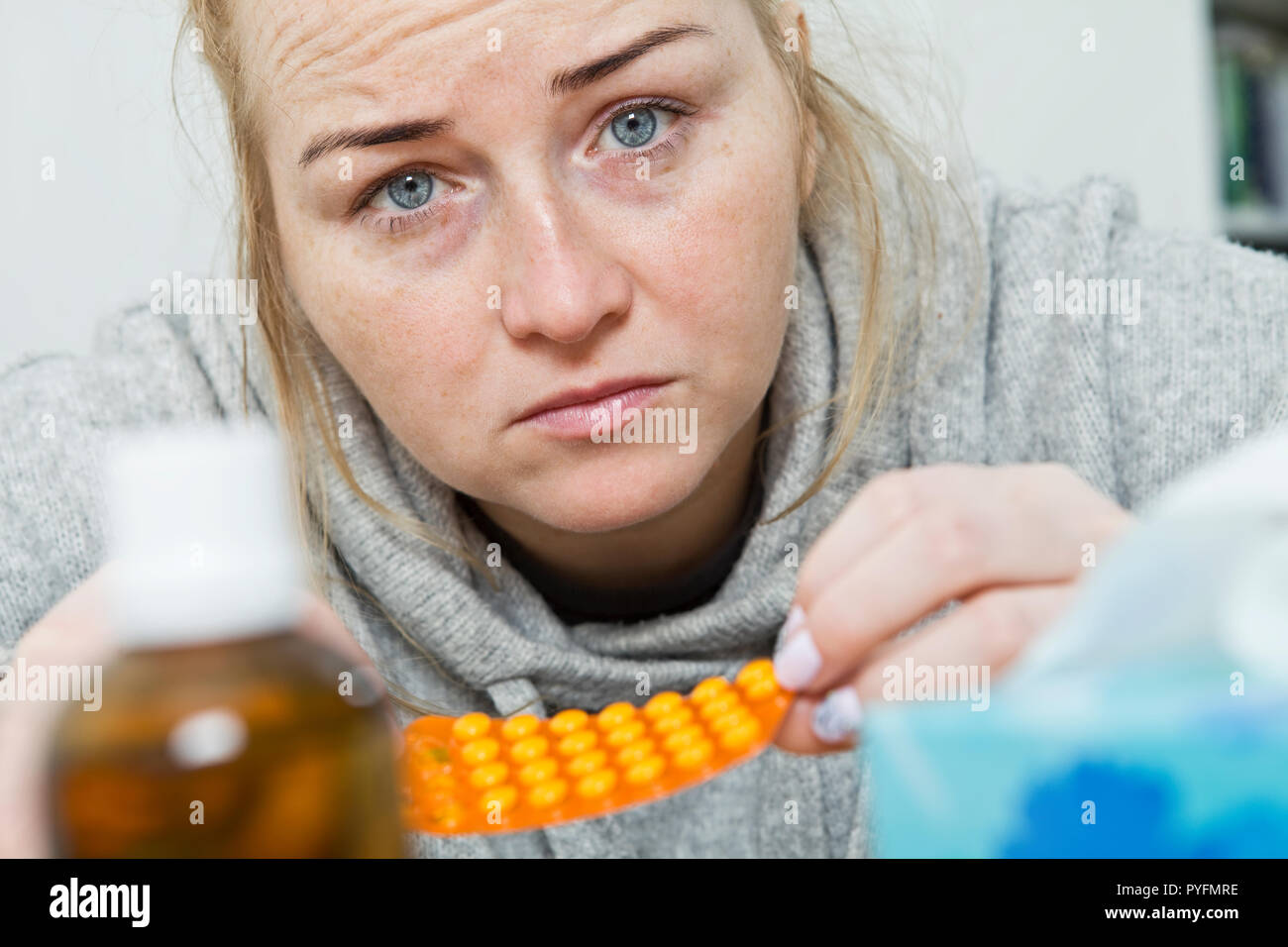 Young woman suffering from headache at home. Depression and bad ...