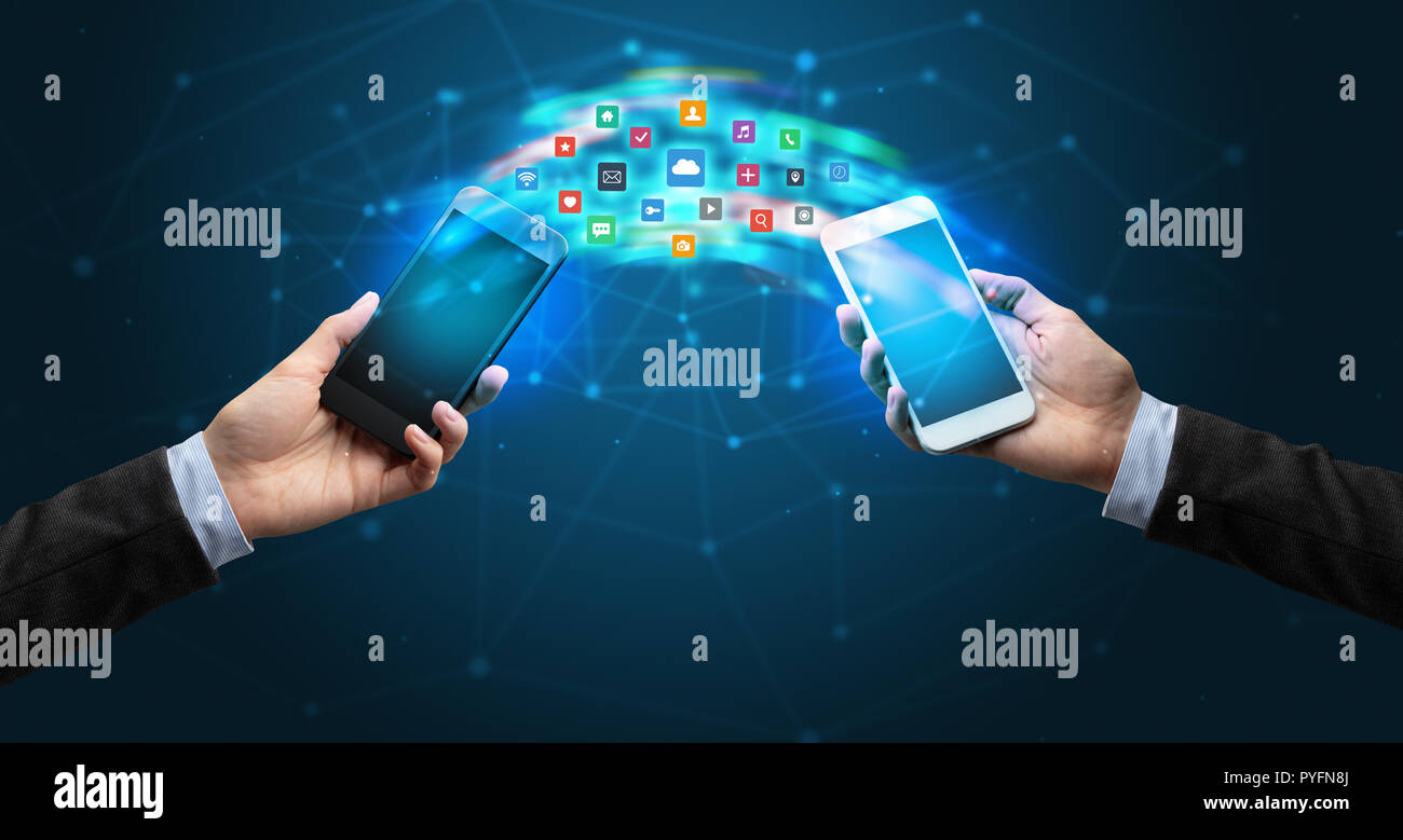Two mobile phones syncing applications concept Stock Photo - Alamy