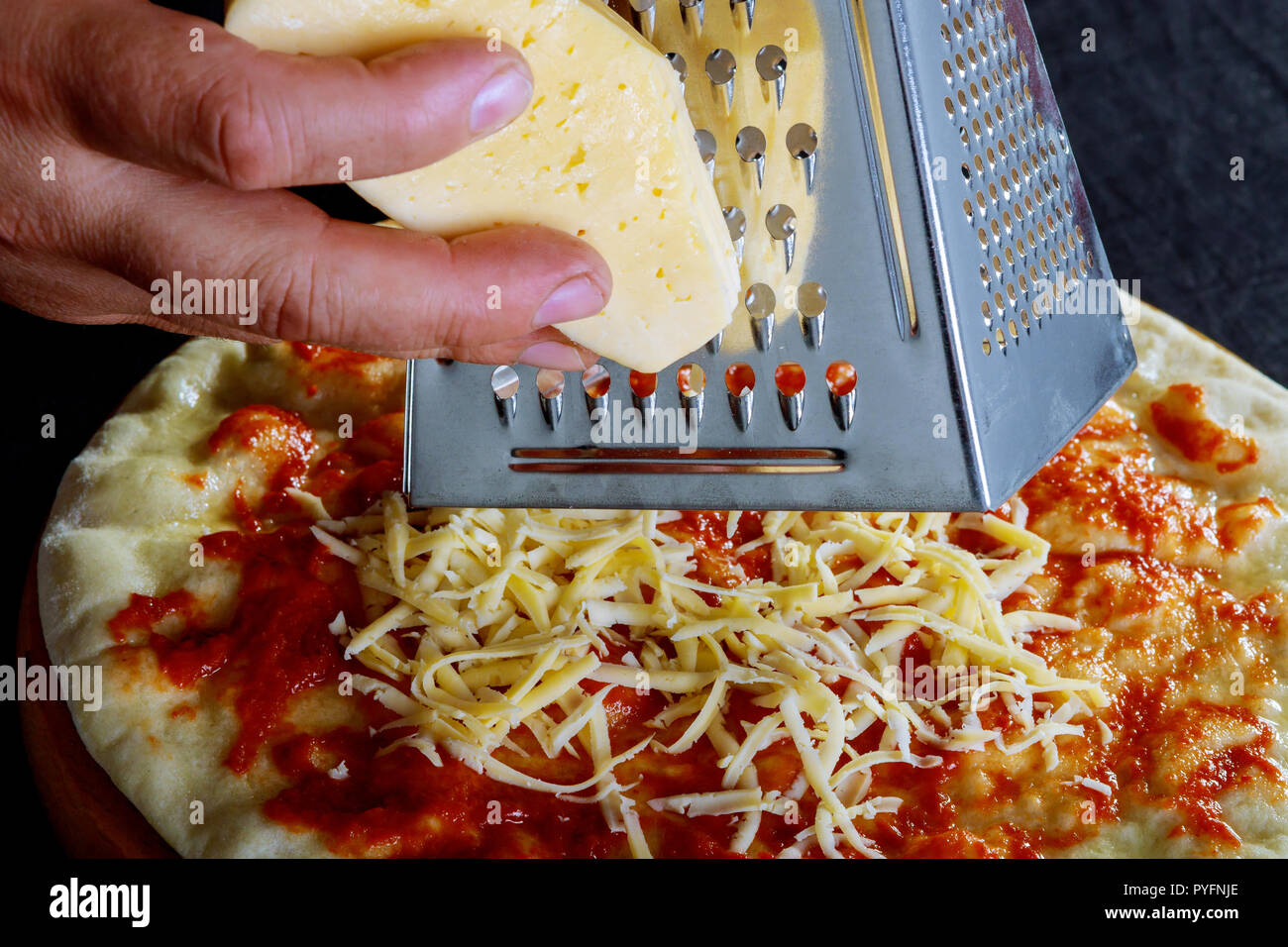 Chef rubs parmesan cheese hi-res stock photography and images - Alamy