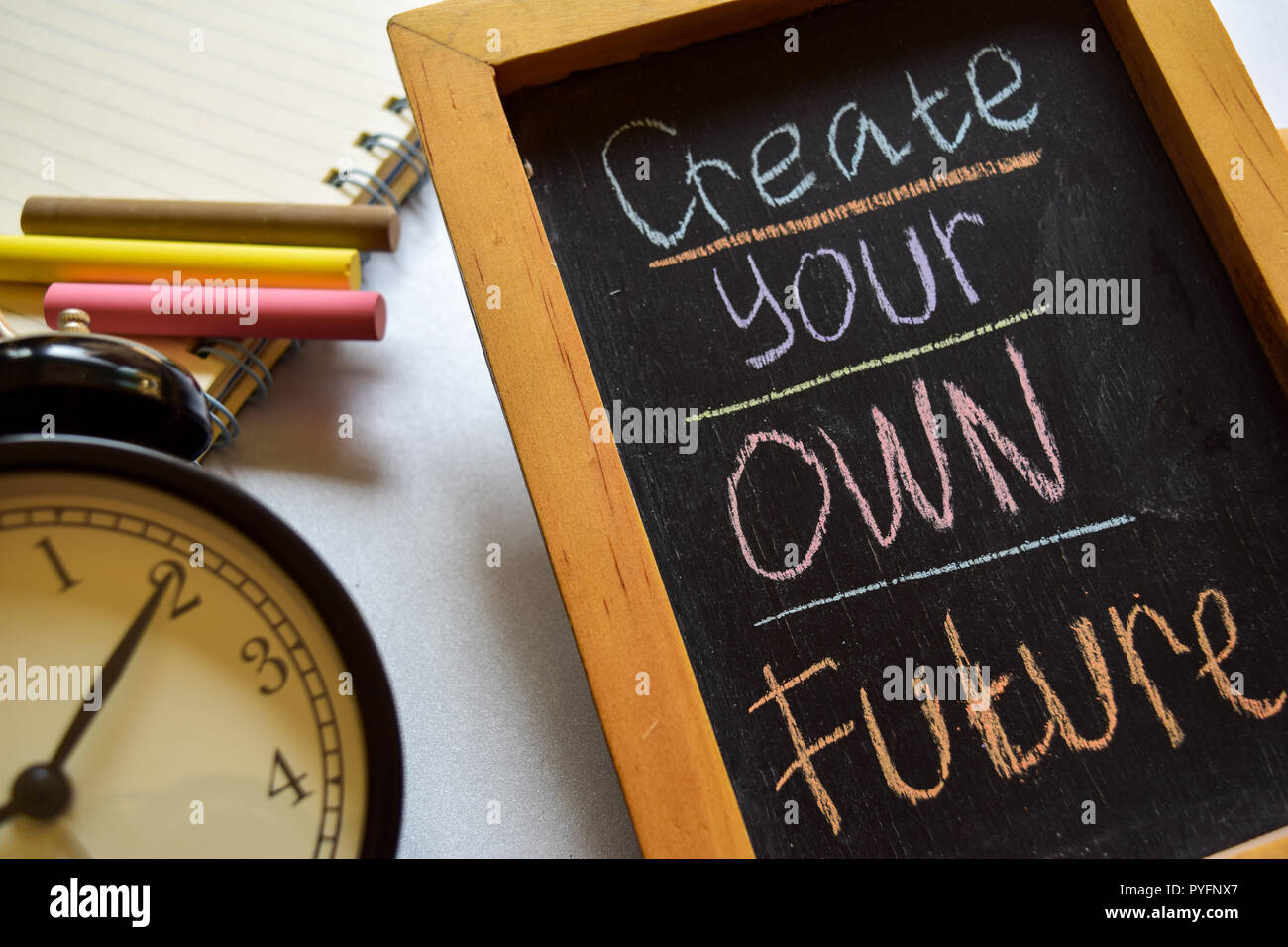 Create your own future on phrase colorful handwritten on chalkboard ...