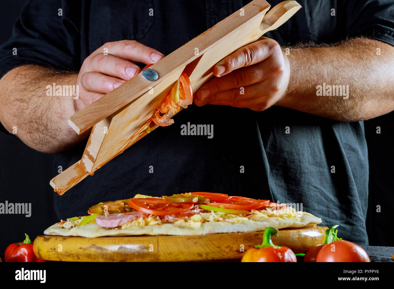 Male chef adding sliced hi-res stock photography and images - Alamy