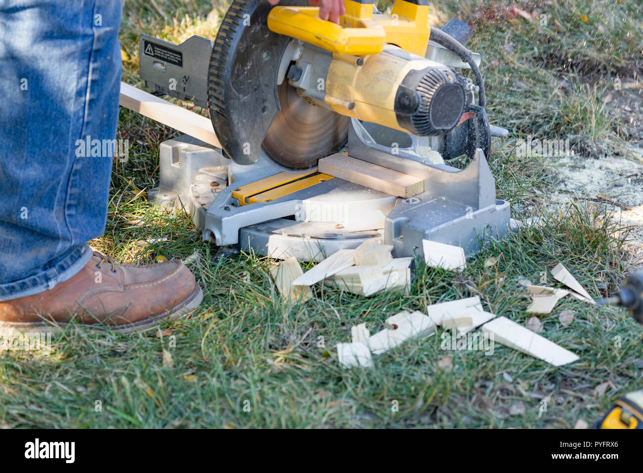 Man using miter saw to cut wood hi-res stock photography and images - Alamy