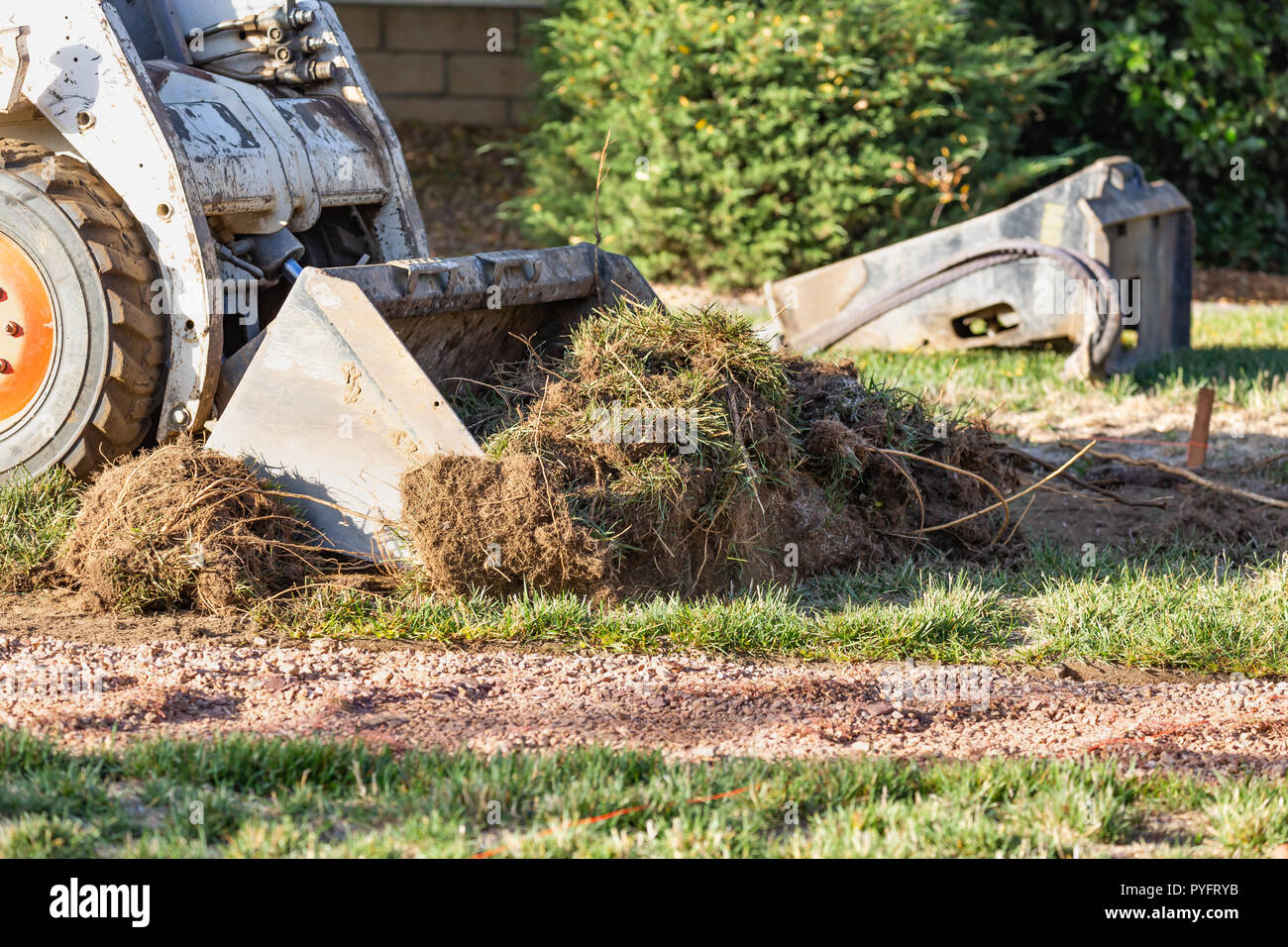 Small Bulldozer Removing Grass From Yard Preparing For Pool ...