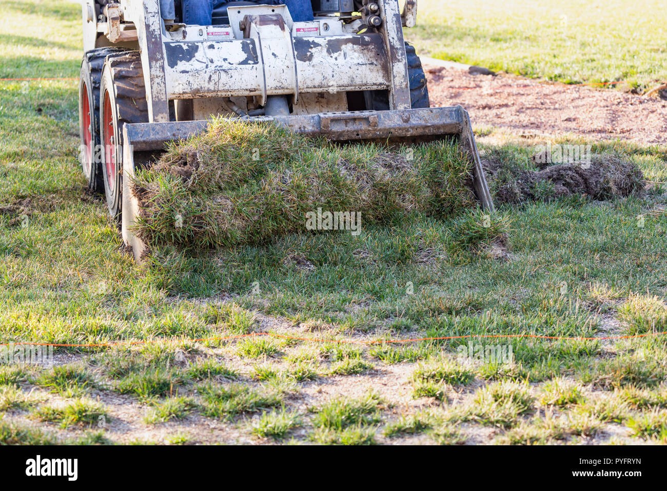 Small Bulldozer Removing Grass From Yard Preparing For Pool ...