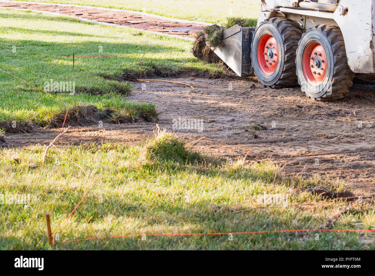 Small Bulldozer Removing Grass From Yard Preparing For Pool ...