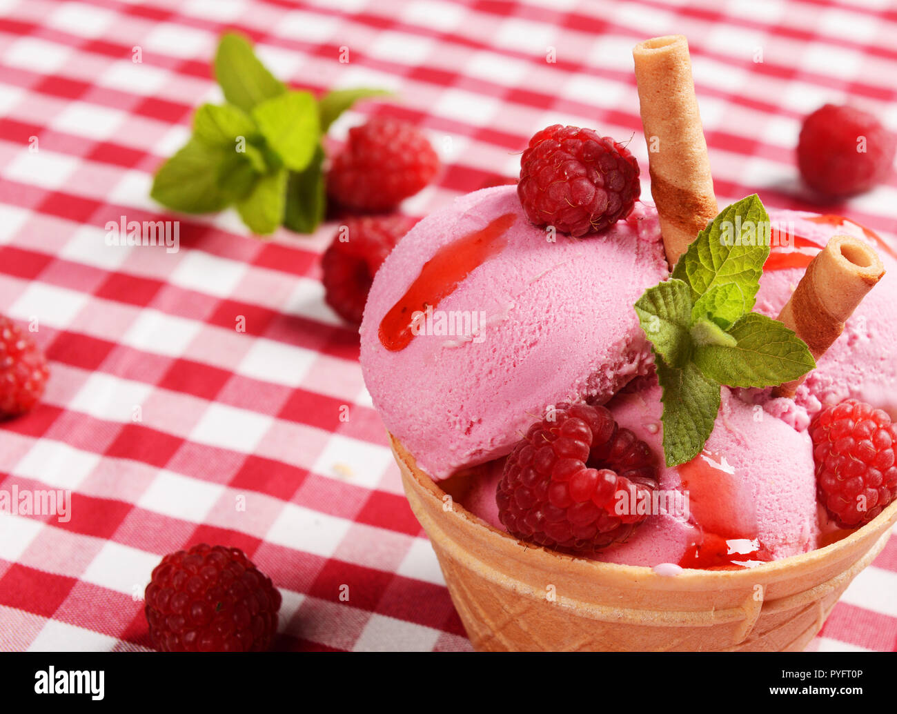 Raspberry topping sauce ice cream hi-res stock photography and images ...