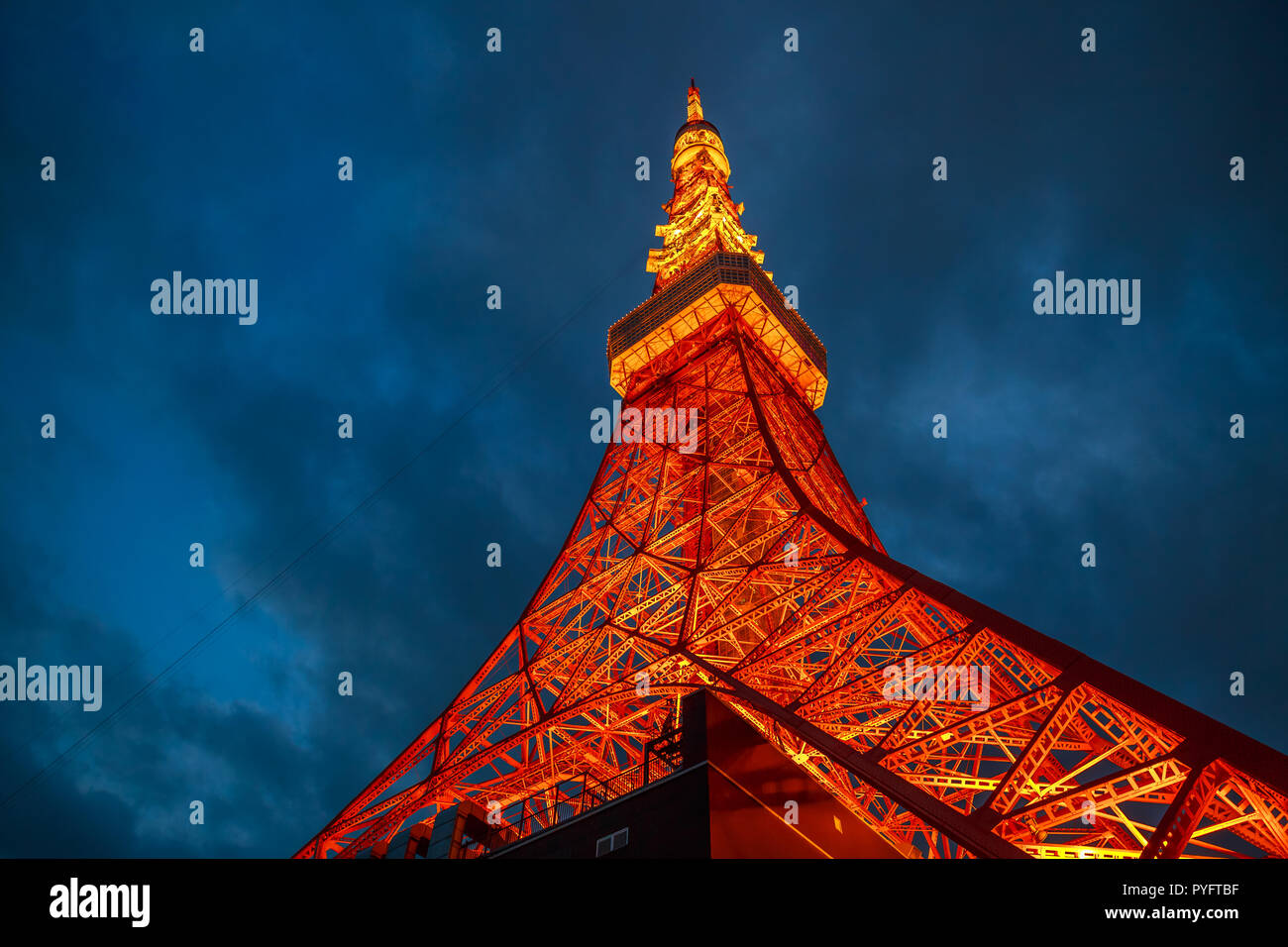 night view of Tokyo Tower illuminated at night. The Tokyo Tower is a ...