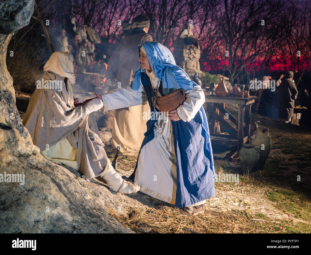 Villaga, Italy - December 30, 2017: Woman helps a leprous beggar during ...