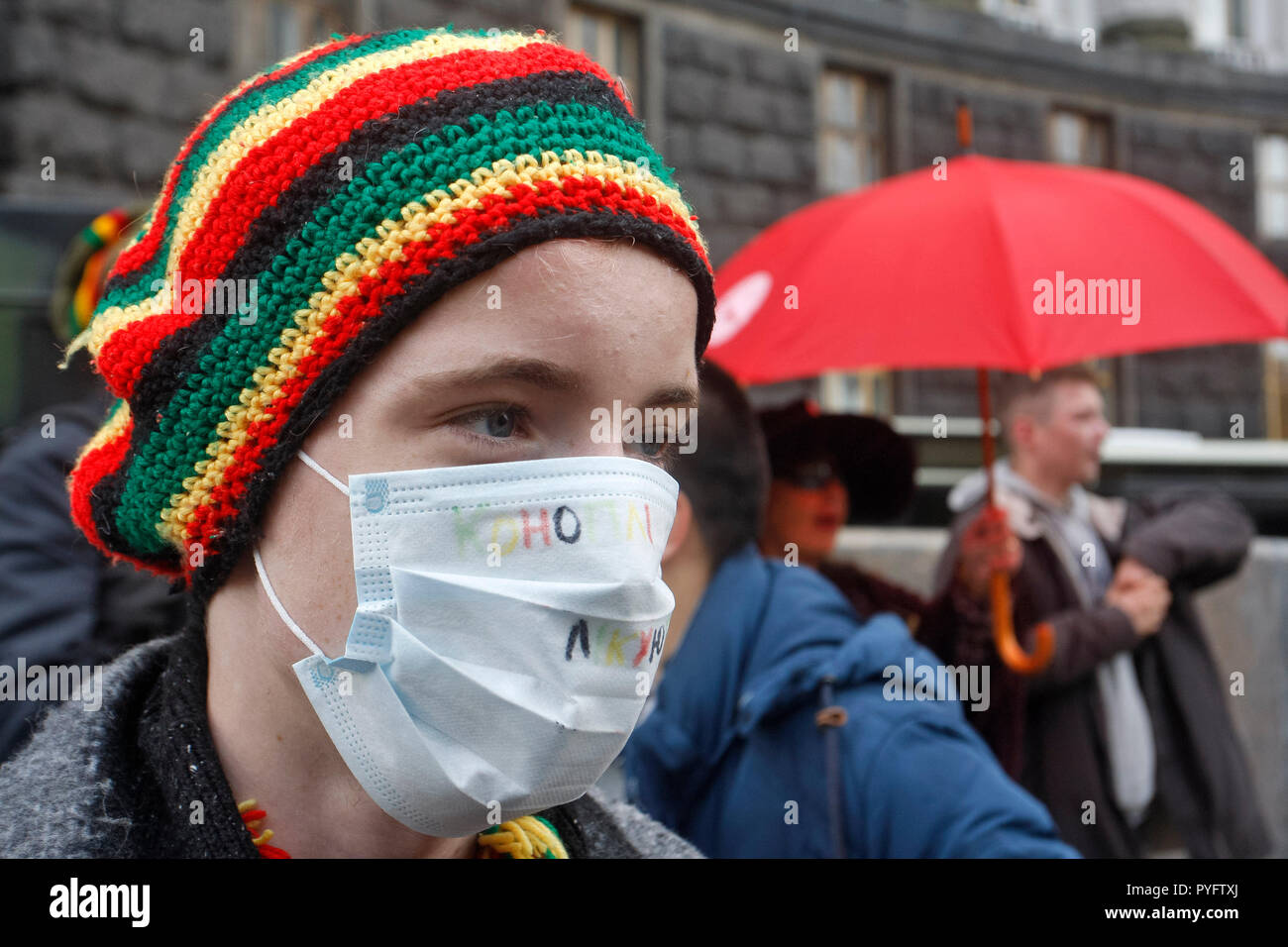 A women seen wearing a disposable face mask during the protest. March ...