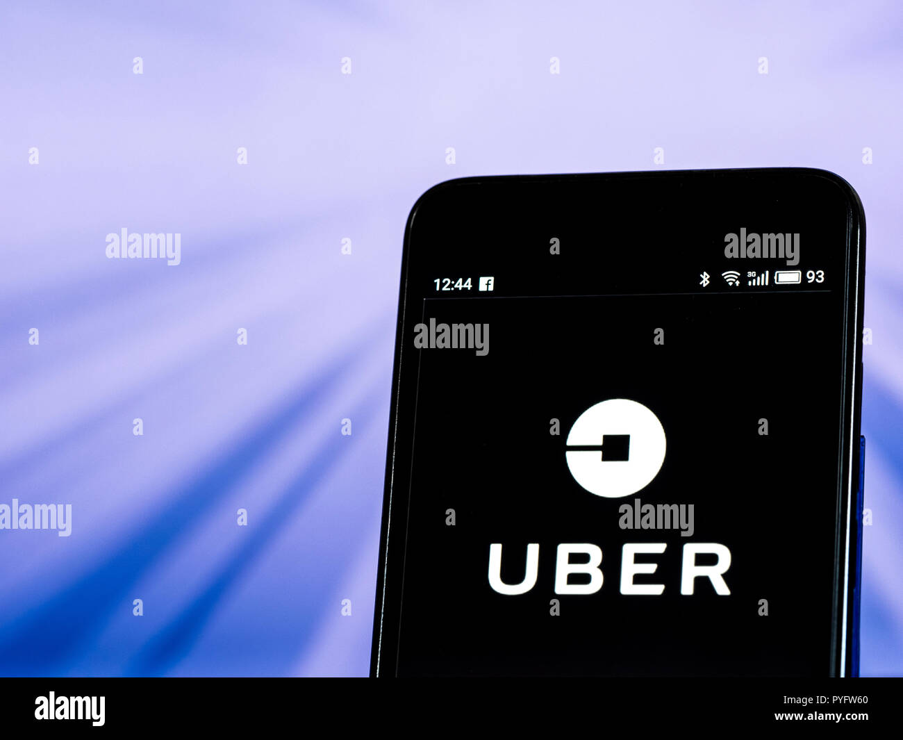 Uber Ride sharing company logo seen displayed on smart phone. Uber ...