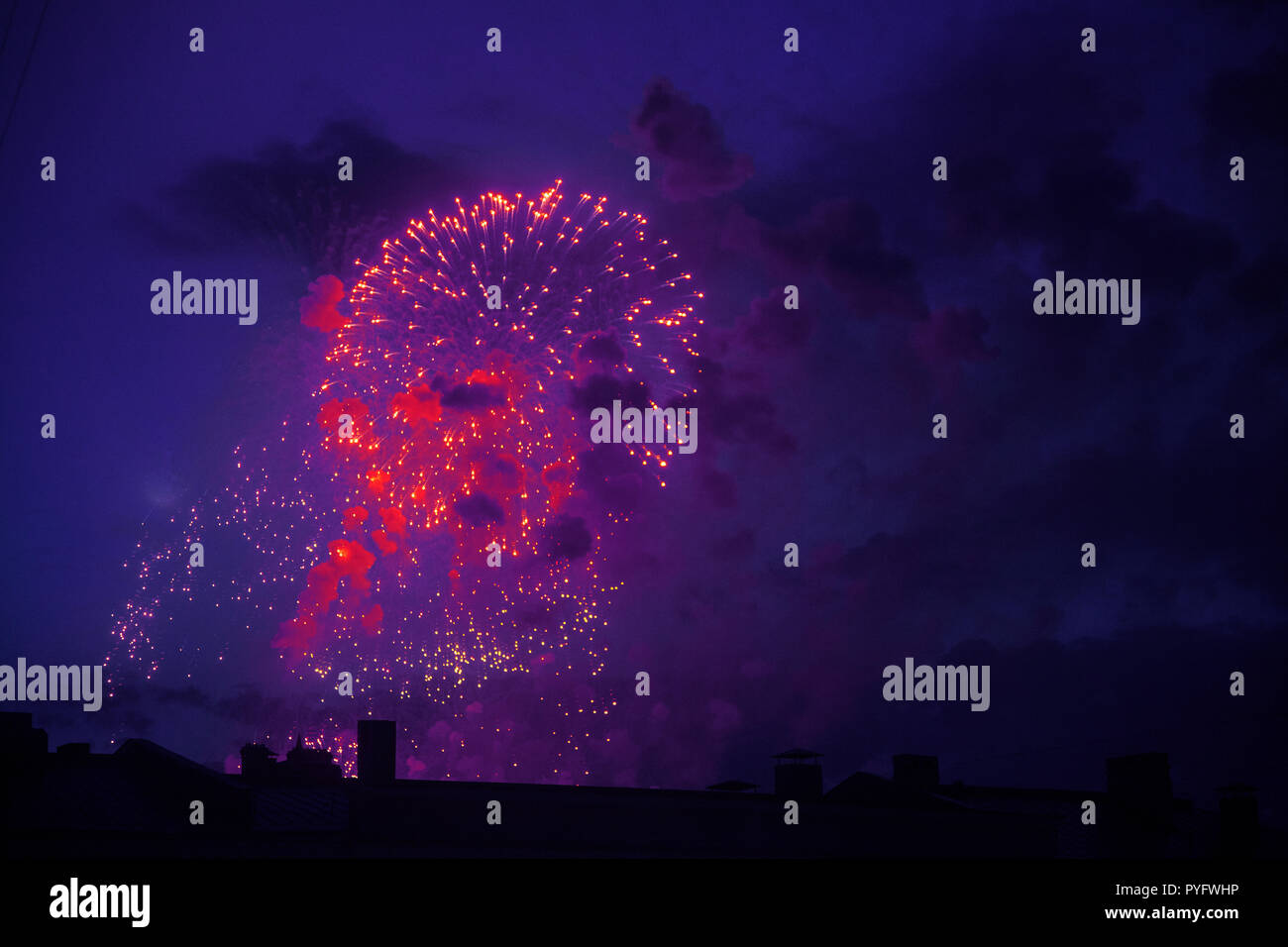 colorful bright fireworks on roof top silhouette, magic holiday Stock ...