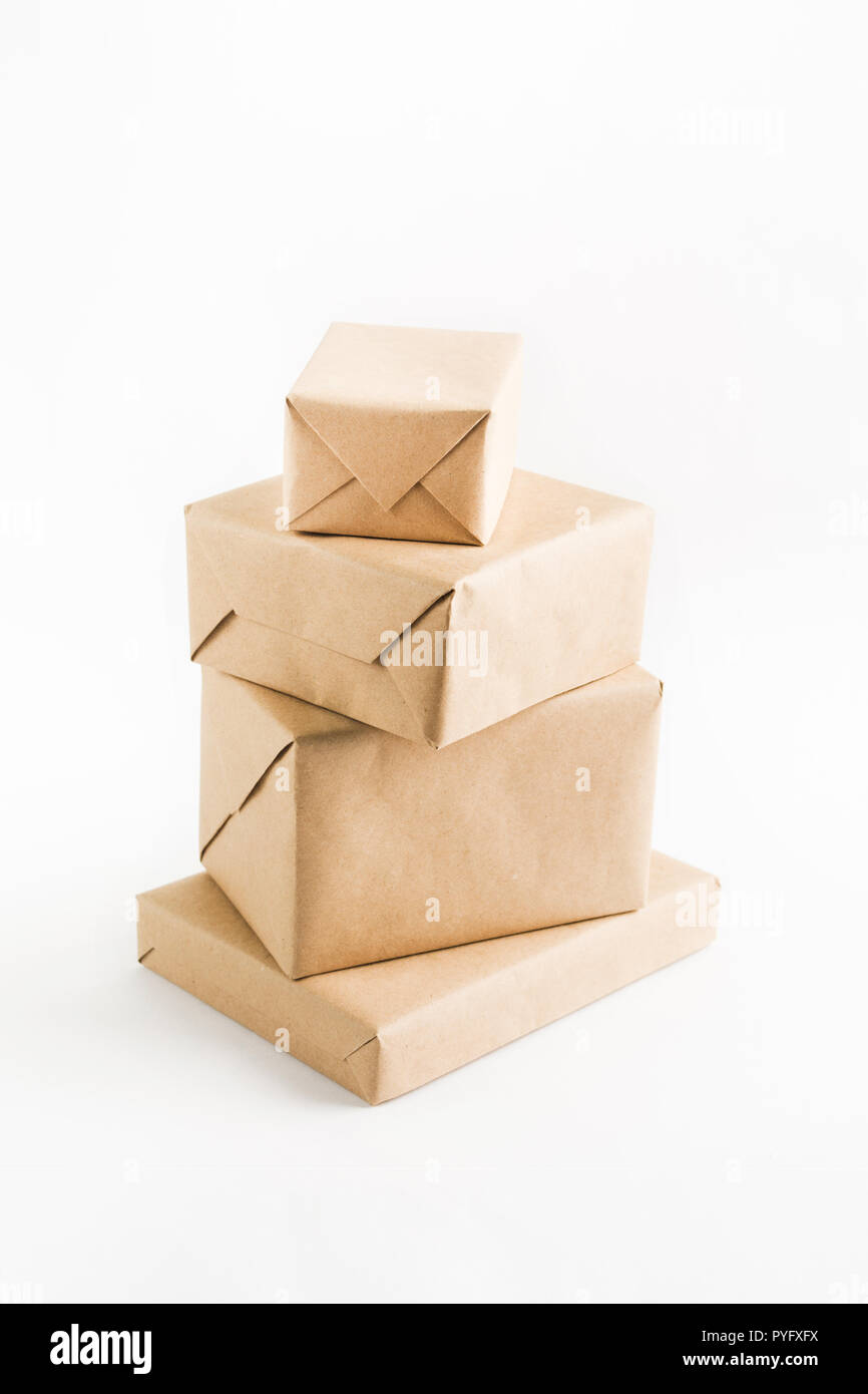 Stack of craft wrapped boxes for delivery on white background Stock ...