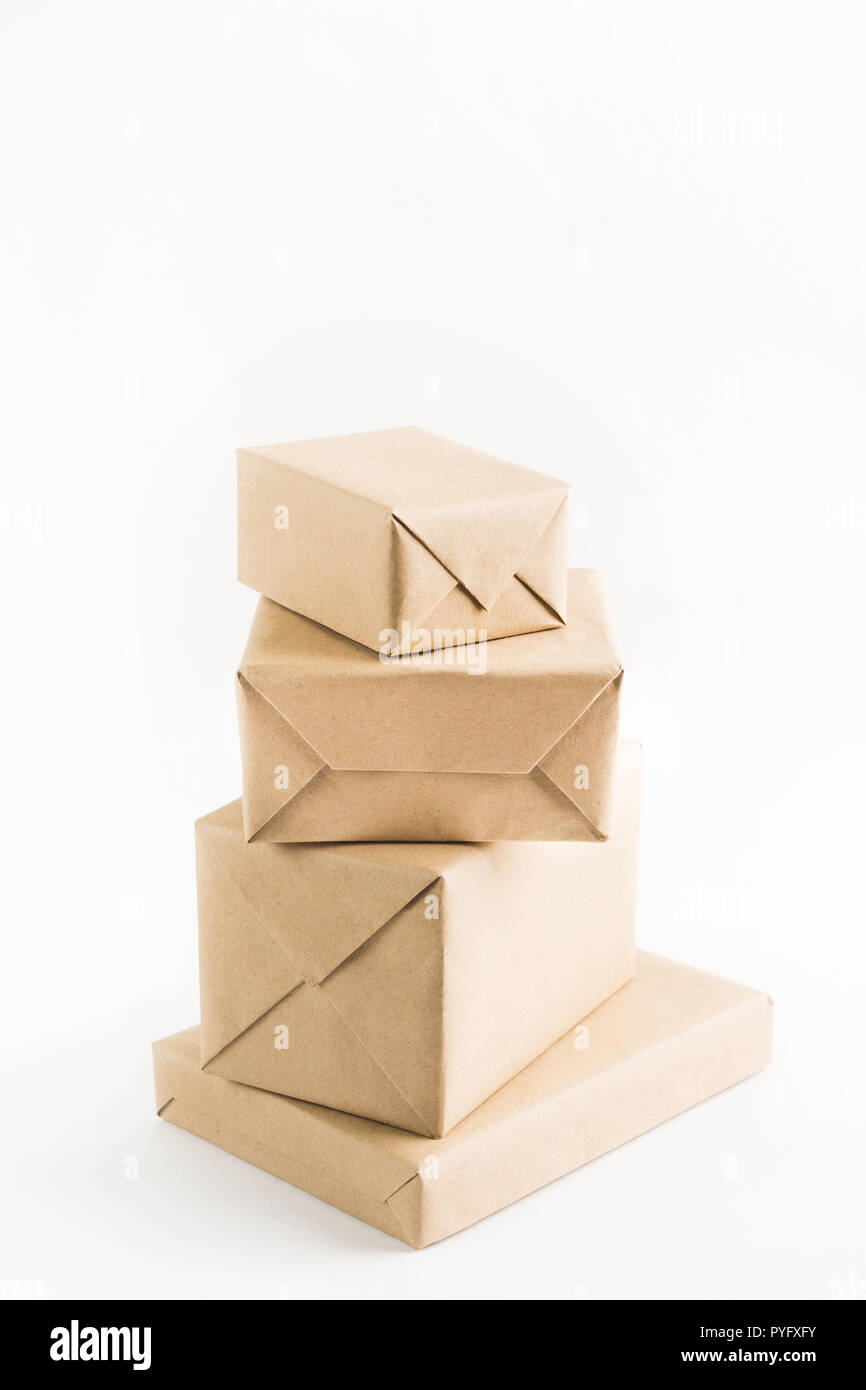 Stack of craft wrapped boxes for delivery on white background Stock ...