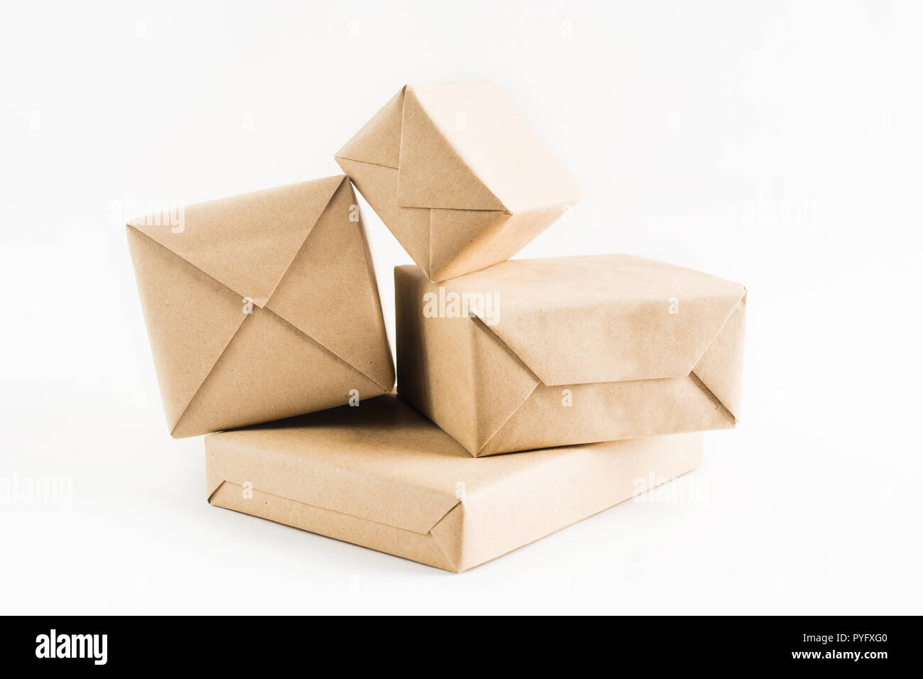 Stack of craft wrapped boxes for delivery on white background Stock ...