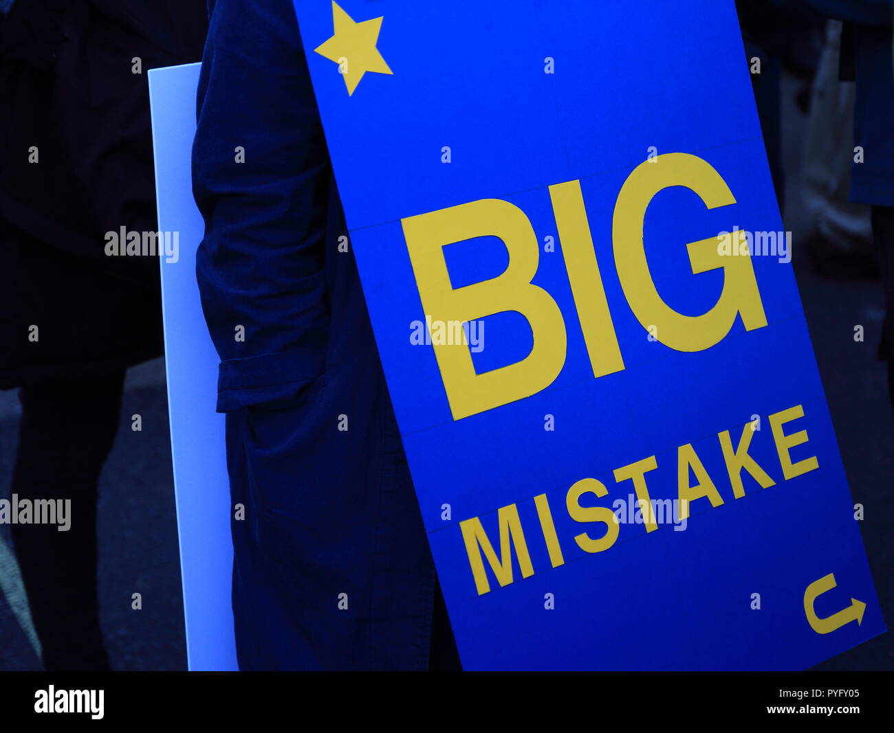 Man holds the blue banner Big mistake Stock Photo - Alamy