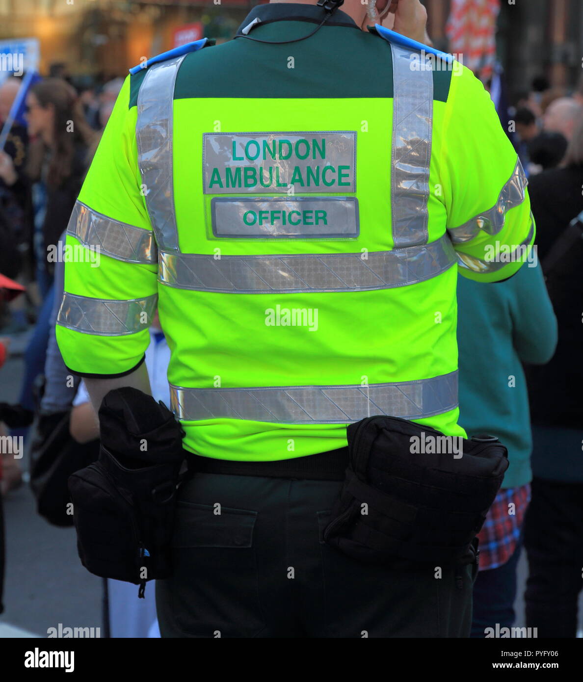 London ambulance officer on duty on city centre street during special ...