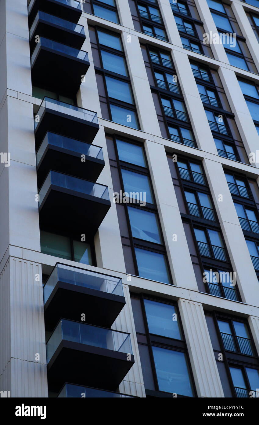 Multi-storey office building with many windows, background Stock Photo ...