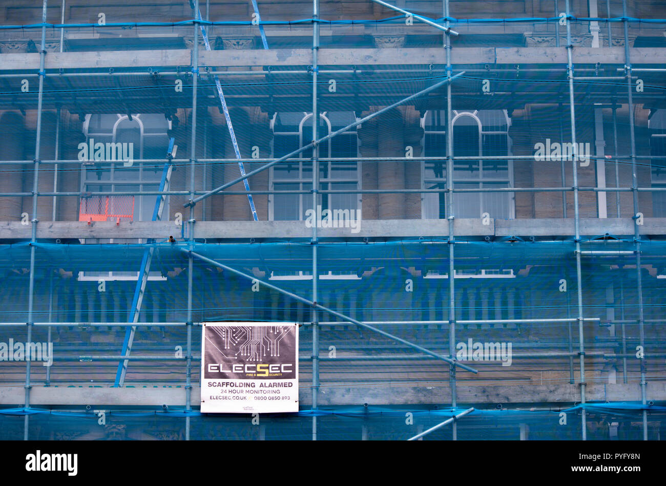 scaffolding with safety netting, renovation works being carried to ...