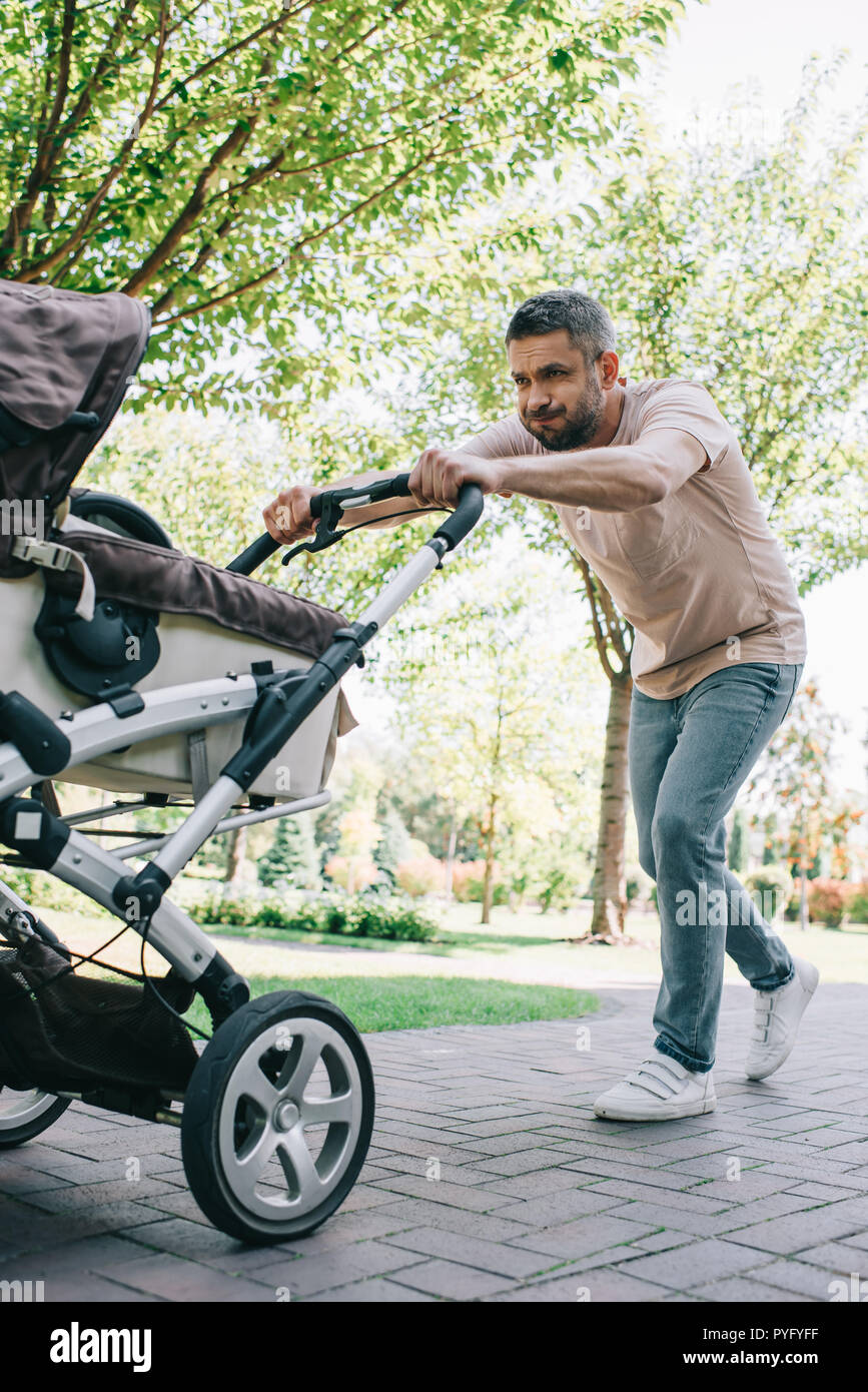 Father pushing buggy hi-res stock photography and images - Alamy