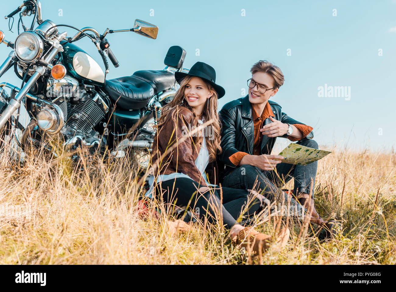 young boyfriend in glasses holding map near beautiful girlfriend ...