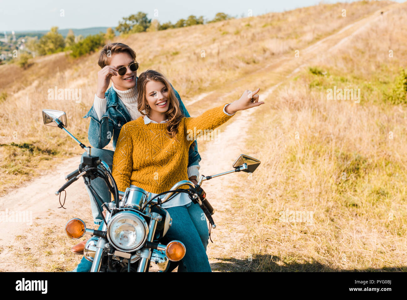 Couple sitting on motorbike hi-res stock photography and images - Alamy