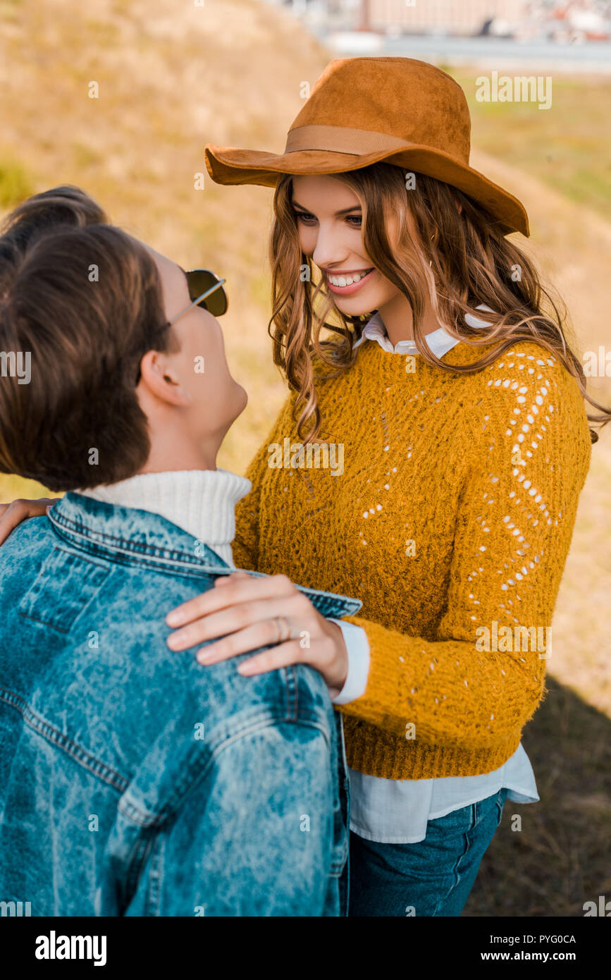 beautiful girlfriend smiling to boyfriend on rural meadow Stock Photo ...