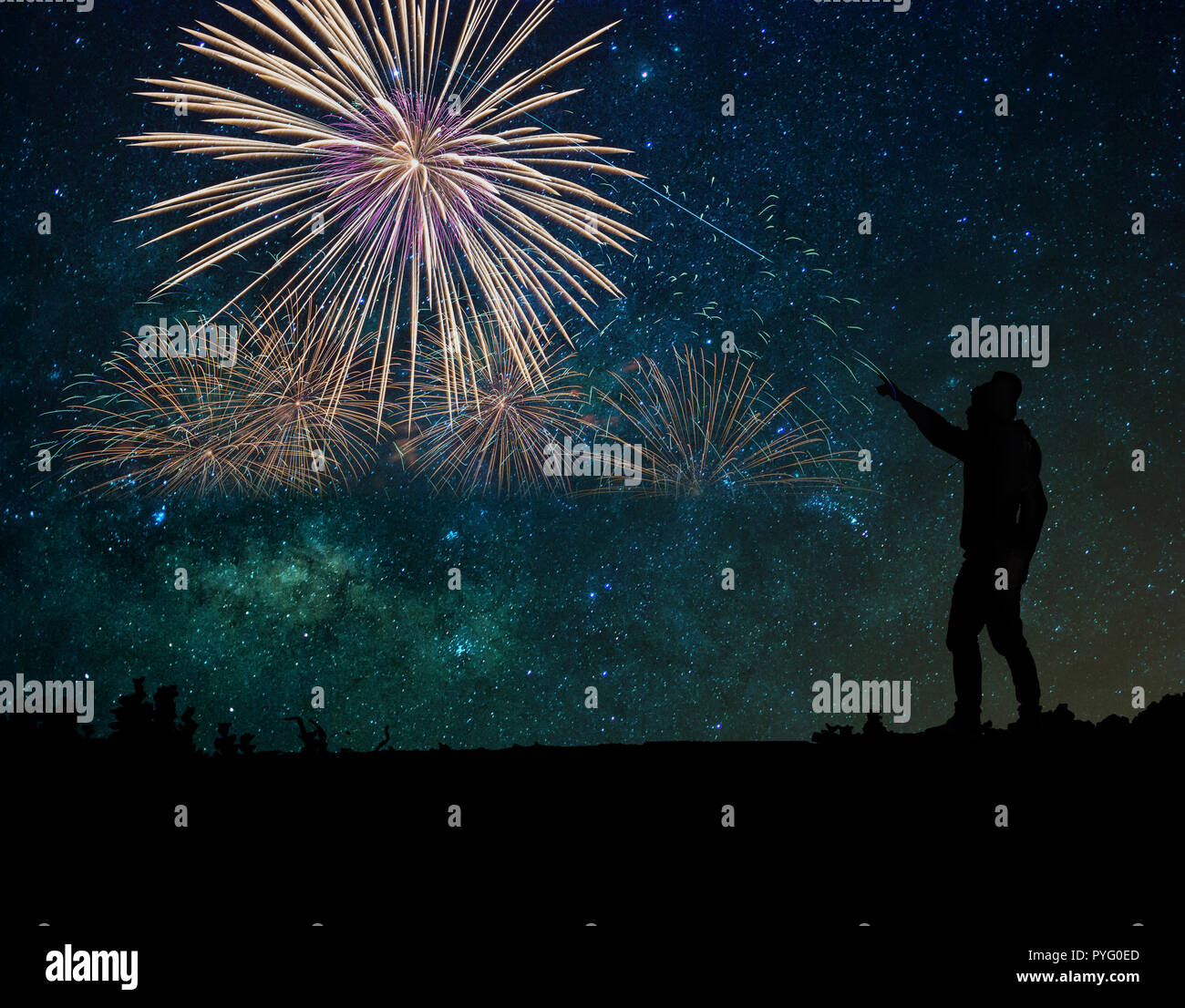 silhouette of a man who standing and pointing to the Multicolor ...