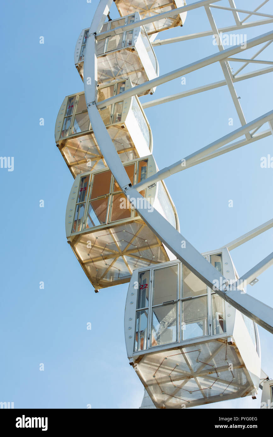 cabins of observation wheel against blue sky in amusement park Stock ...
