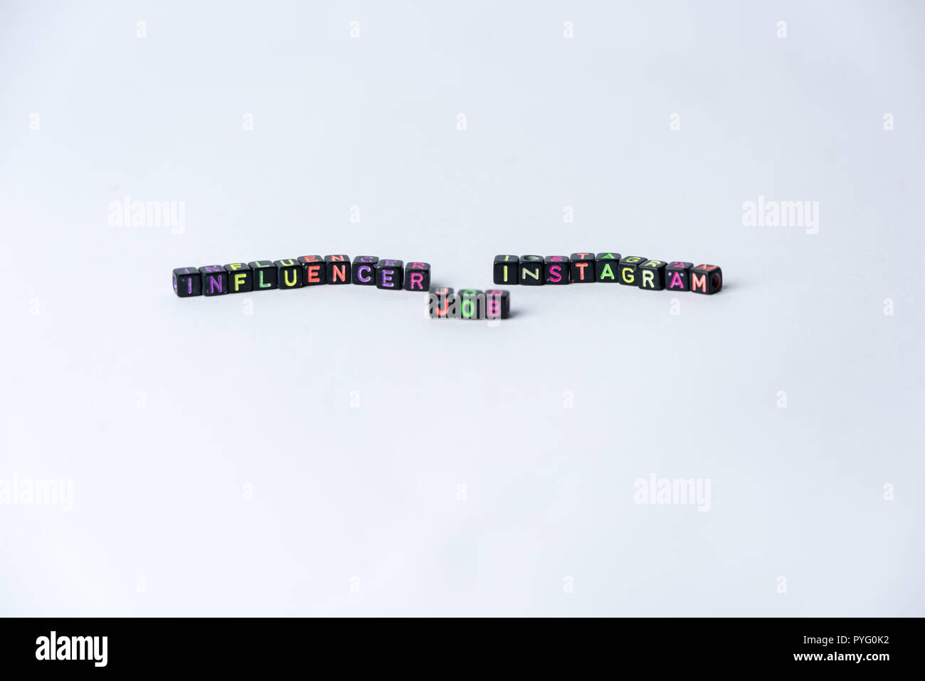 Text `Influencer, Job, Instagram` composed of small black blocks with ...